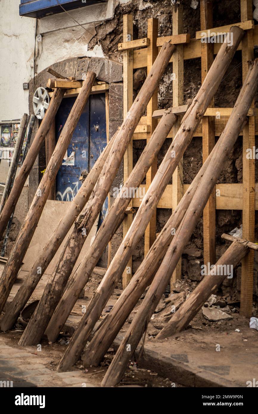 Peruvian Wooden barricade holding a wall up Stock Photo - Alamy