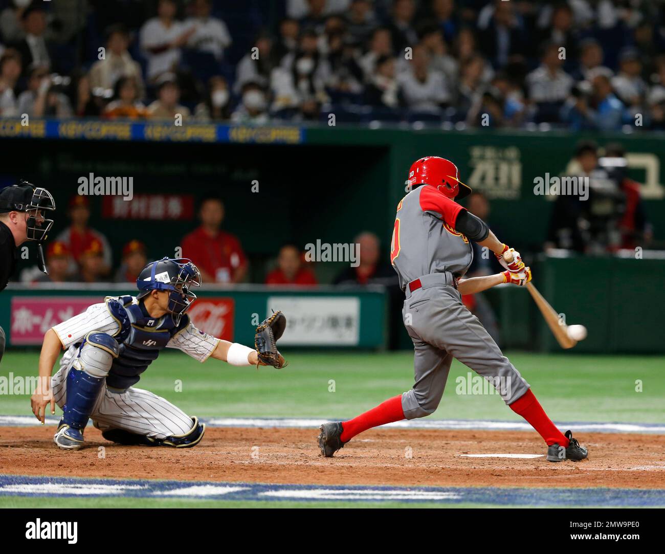 China's last batter Li Ning hits a grounder to first to end the first ...