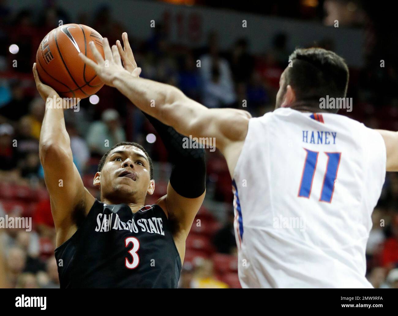 San Diego State's Trey Kell shoots as Boise State's Zach Haney defends ...