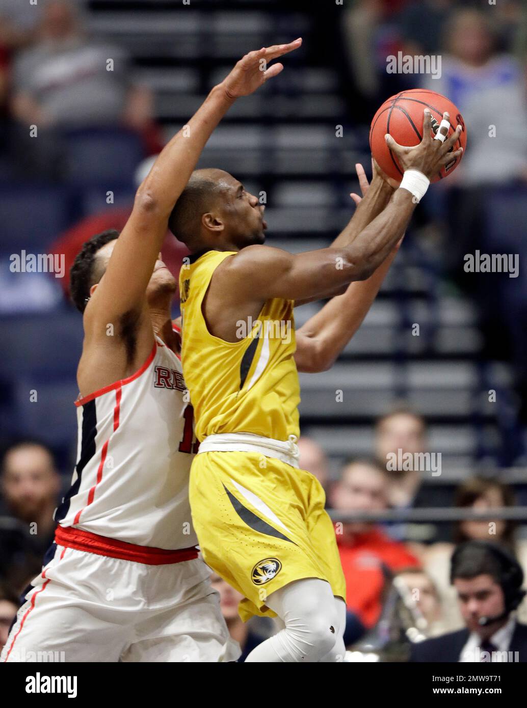 Missouri guard Terrence Phillips, right, scores ahead of Mississippi ...