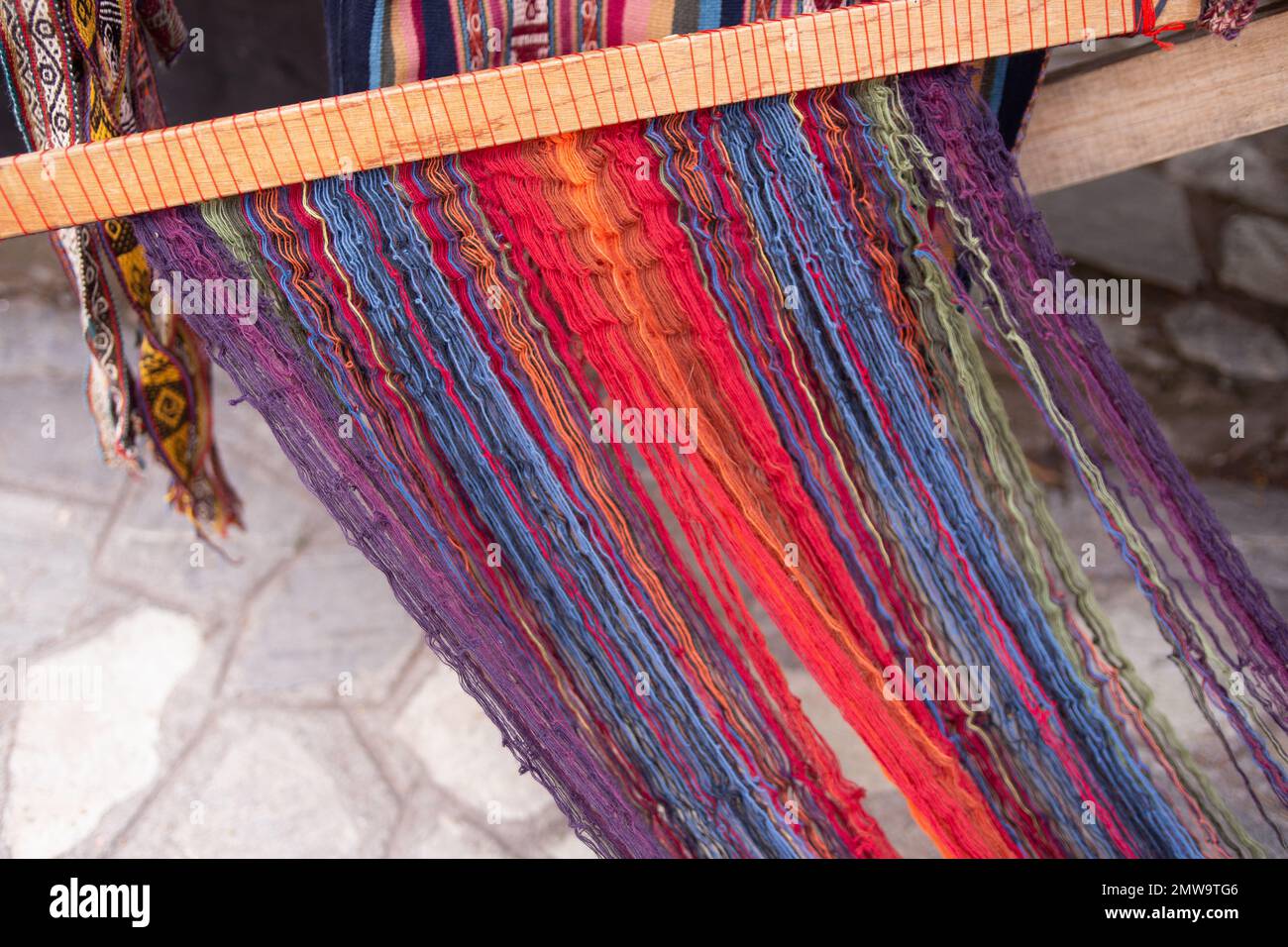 Peruvian Yarn on a loom weaving Stock Photo - Alamy