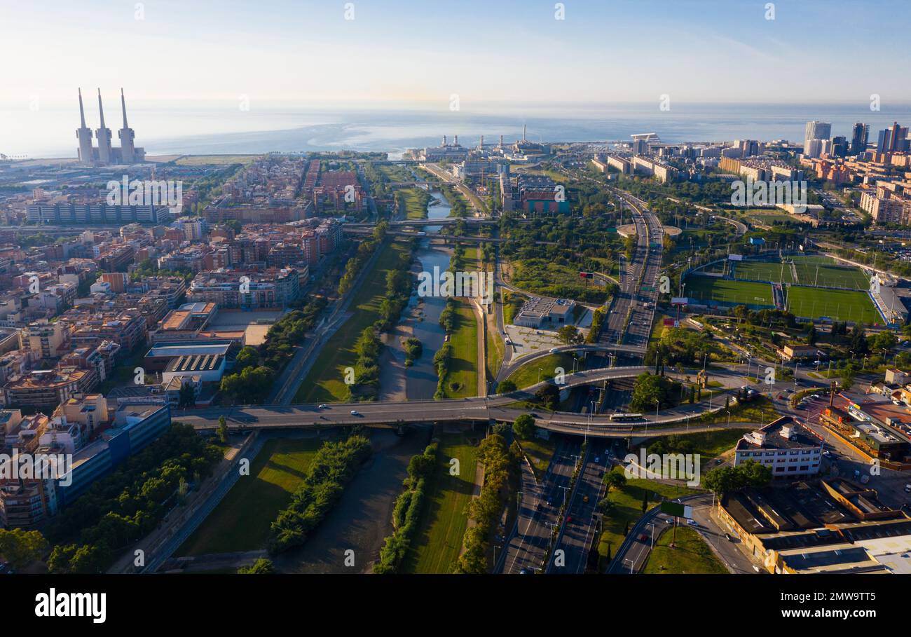 Aerial view of Besos river with Barcelona and Sant Adria on its banks ...