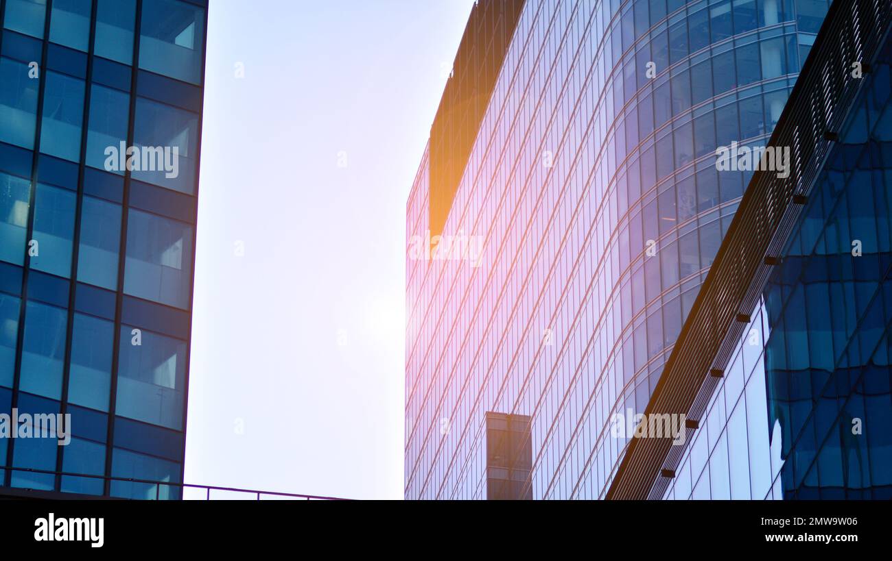 Abstract closeup of the glass-clad facade of a modern building covered ...