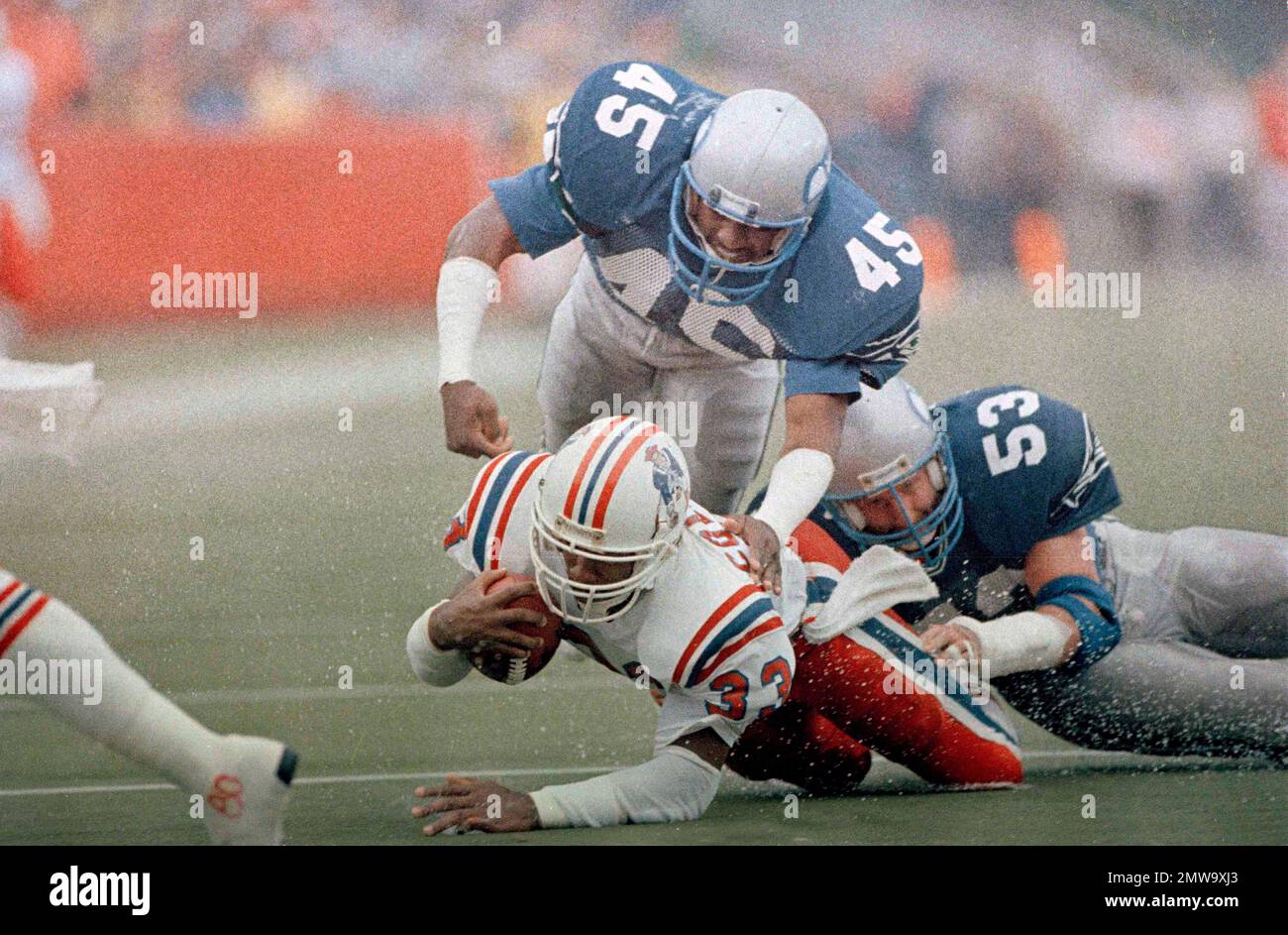 New England Patriots Tony Collins (33) struggles for that extra yard ...