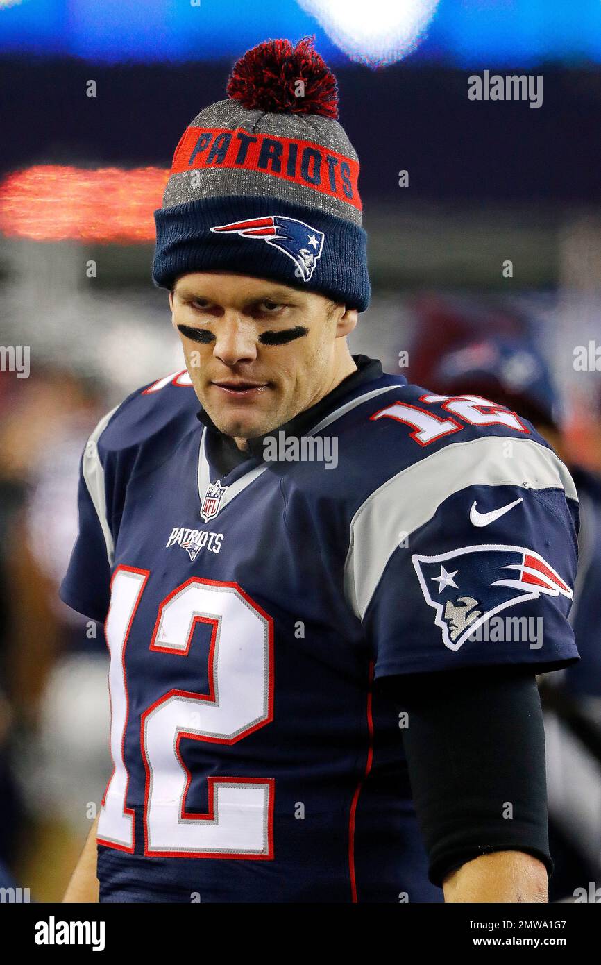 New England Patriots quarterback Tom Brady eyes his teammates on the ...