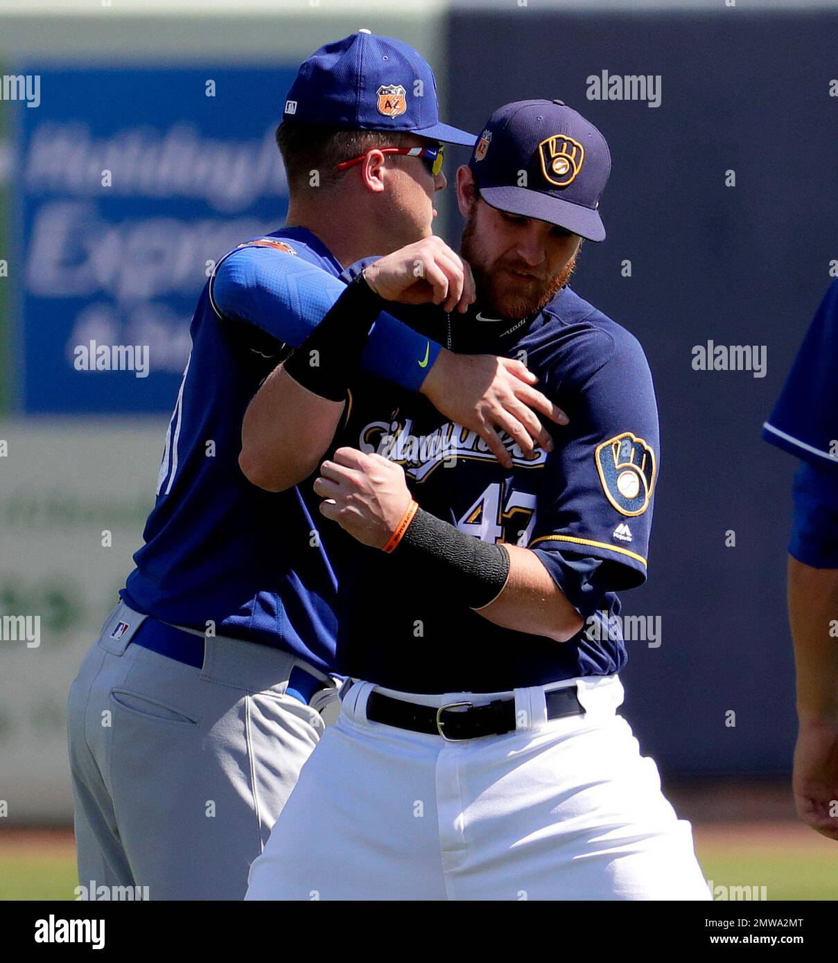 Los Angeles Dodgers' Joc Pederson (31) and Milwaukee Brewers Jett Bandy ...
