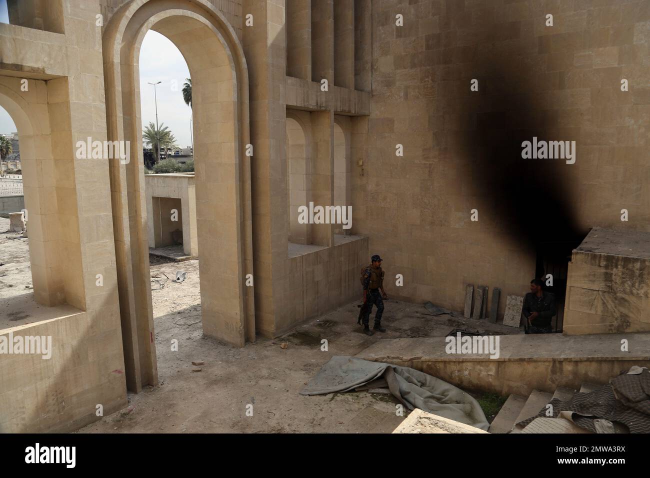 Iraqi federal police inspect Mosul's heavily damaged museum. Most of ...