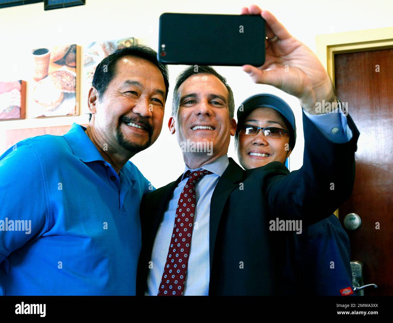 Los Angeles Mayor Eric Garcetti takes a selfie with Alexander Dona and ...