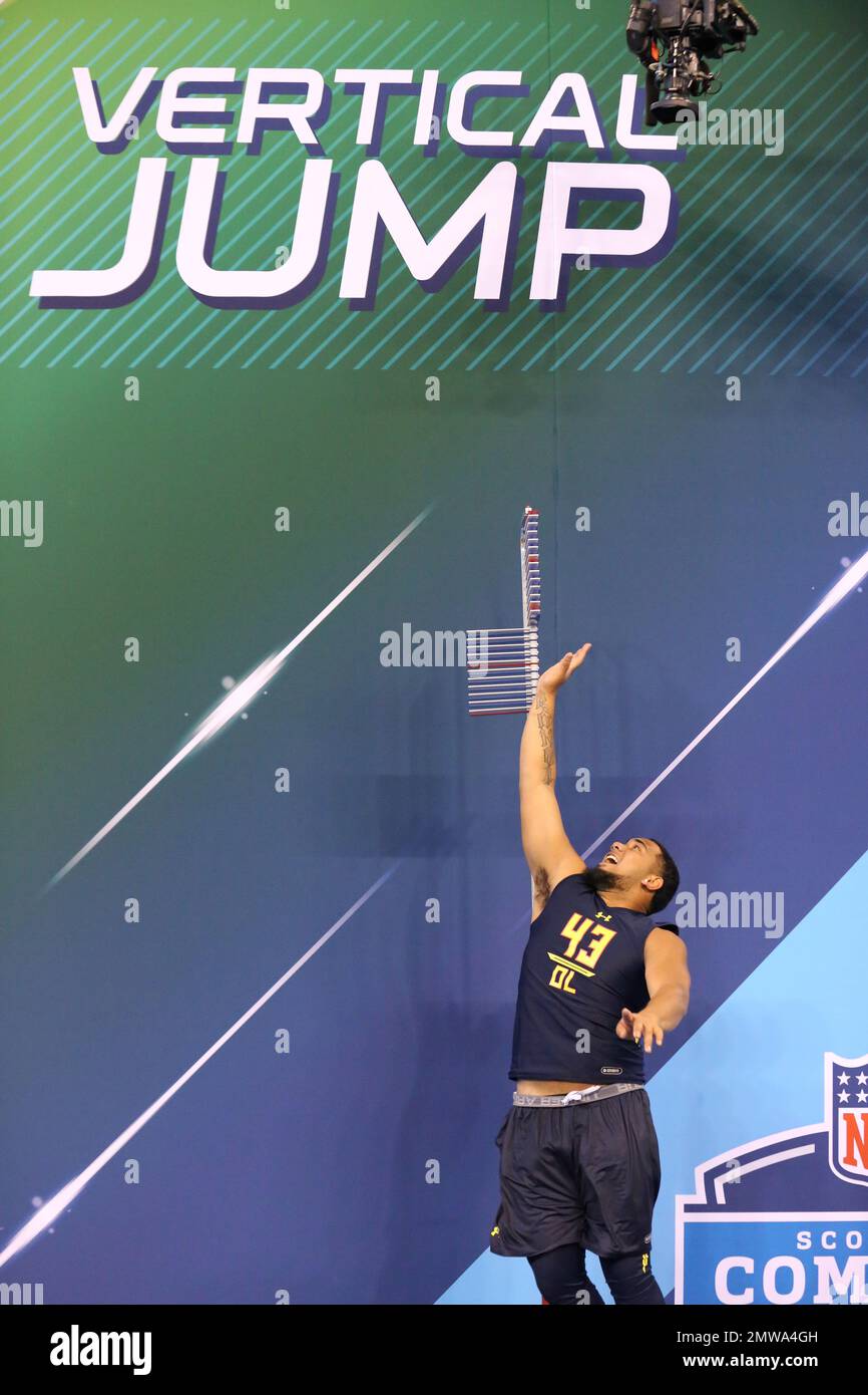 Utah offensive tackle Sam Tevi competes in the vertical jump at the ...