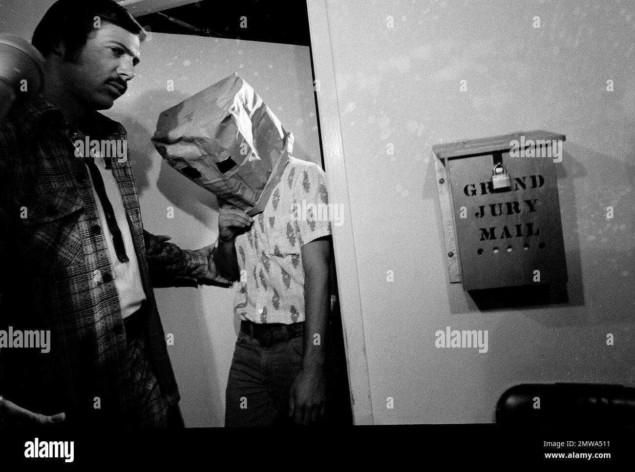 Wearing a sack over his head, Billy Ridinger, 20, who reportedly ...