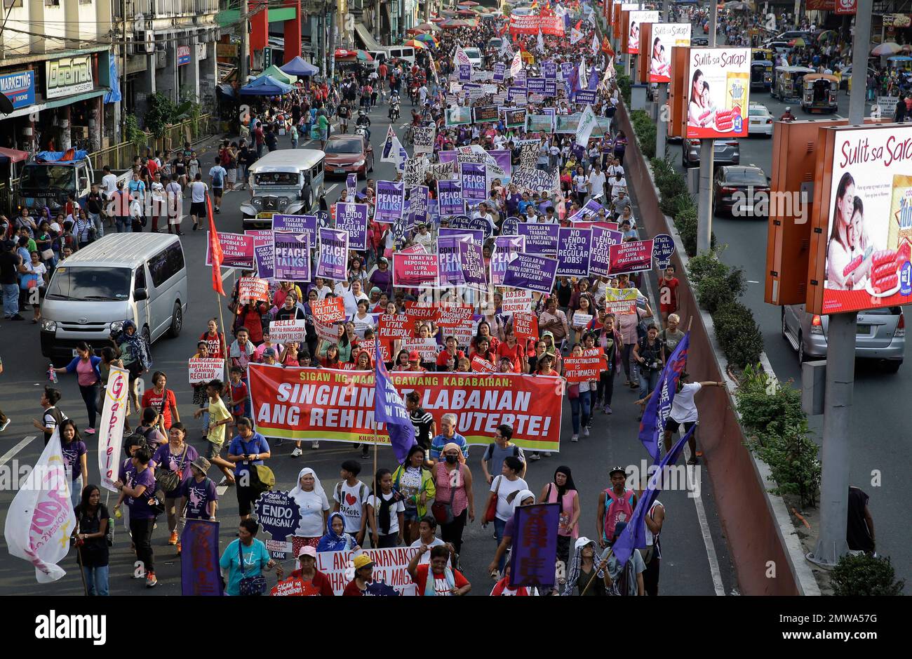 Protesters march towards the Malacanang Presidential palace during a ...