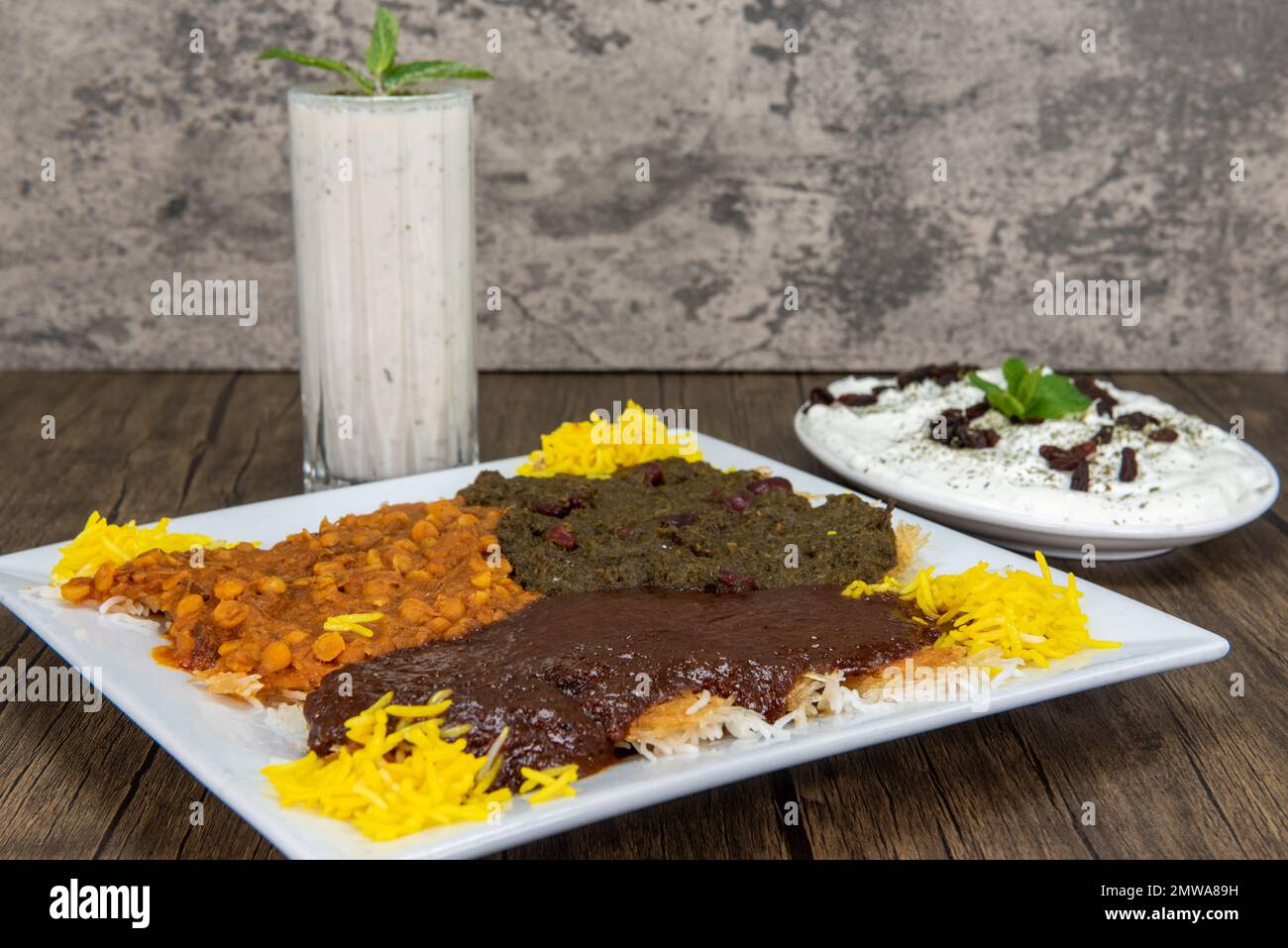 Full Persian meal consisting of tahdig crispy rice, smothered in ...