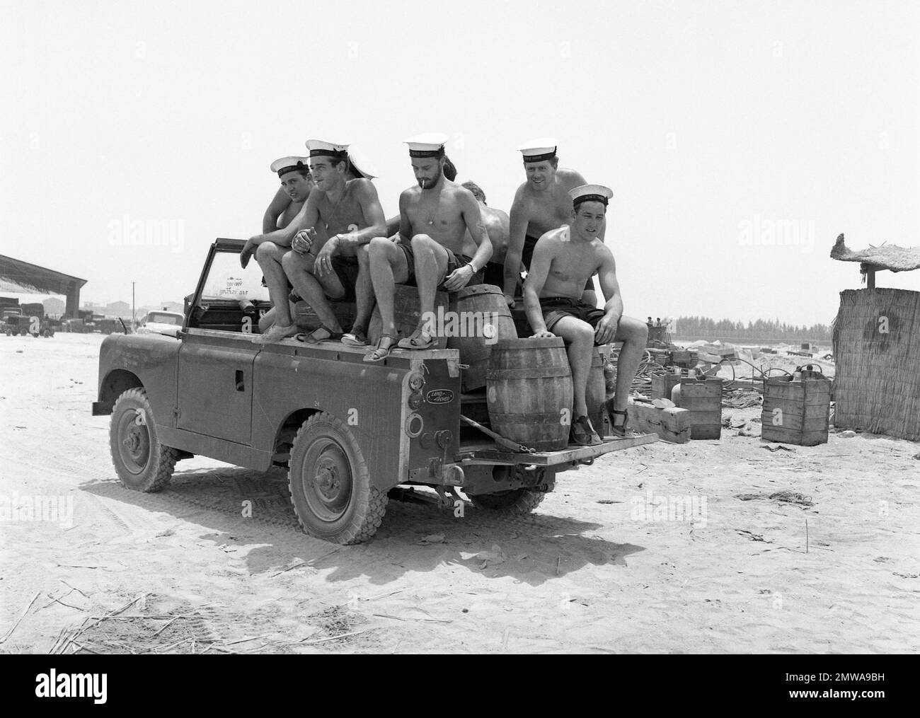 British Royal Navy personnel sit on the truck carrying rum rations in ...
