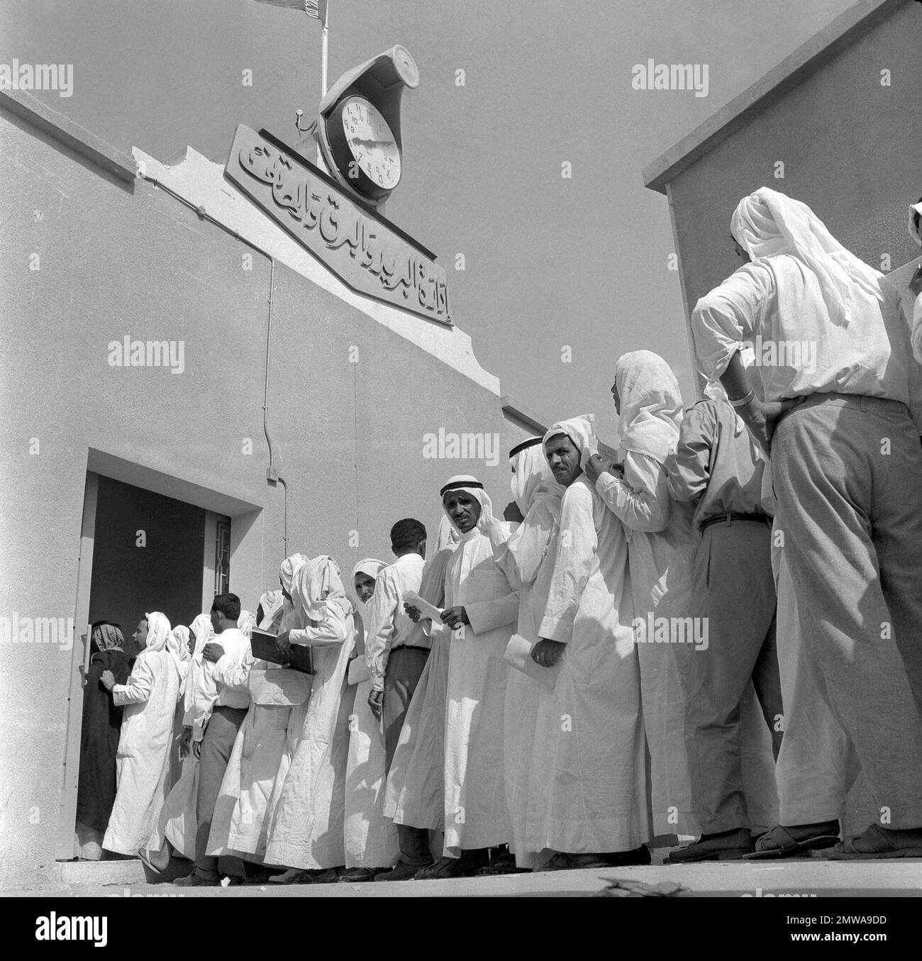 Bedouin tribesmen from outlying areas of Kuwait line up outside the ...