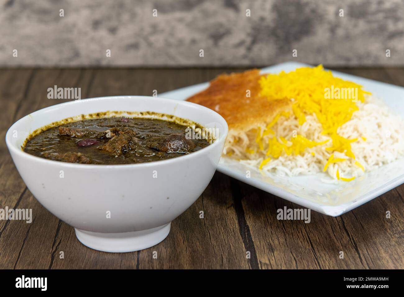 Hearty side of basmati crispy rice with traditional ghormeh sabzi stew ...