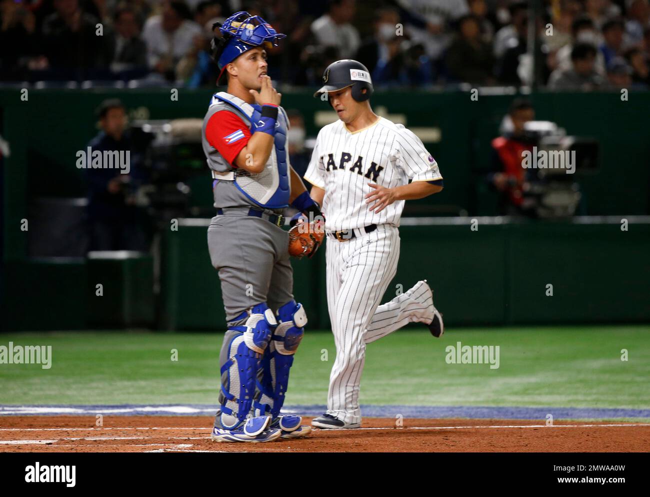 Japan's Norichika Aoki scores on Yoshitomo Tsutsugo's RBI single as ...