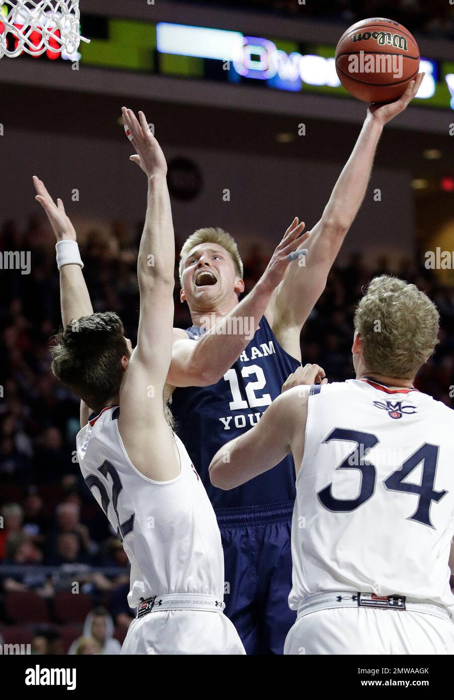 BYU's Eric Mika (12) shoots against Saint Mary's Dane Pineau, left, and ...