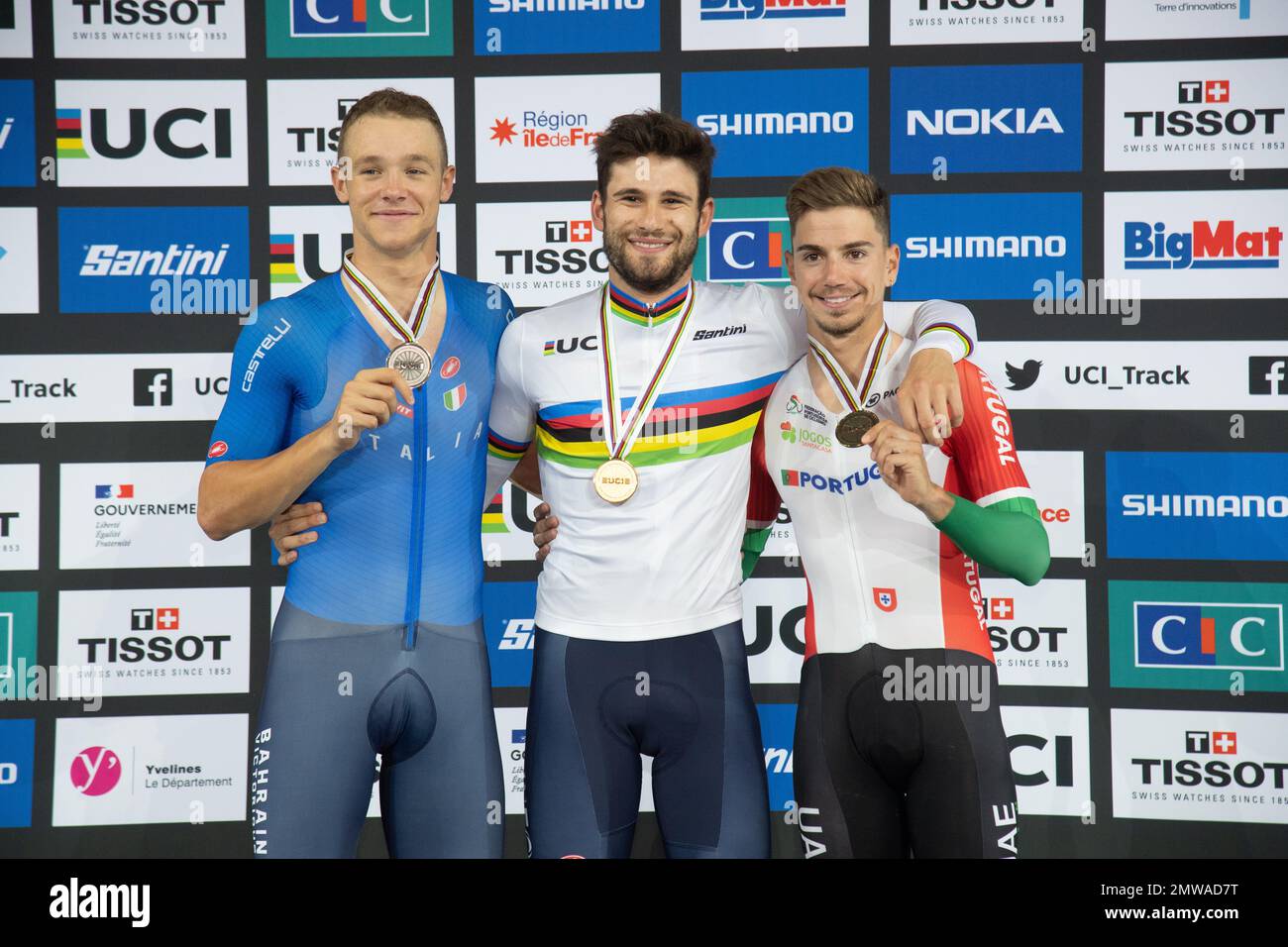 Gold medalist Filippo Ganna(C) of Italy on the podium with second place ...