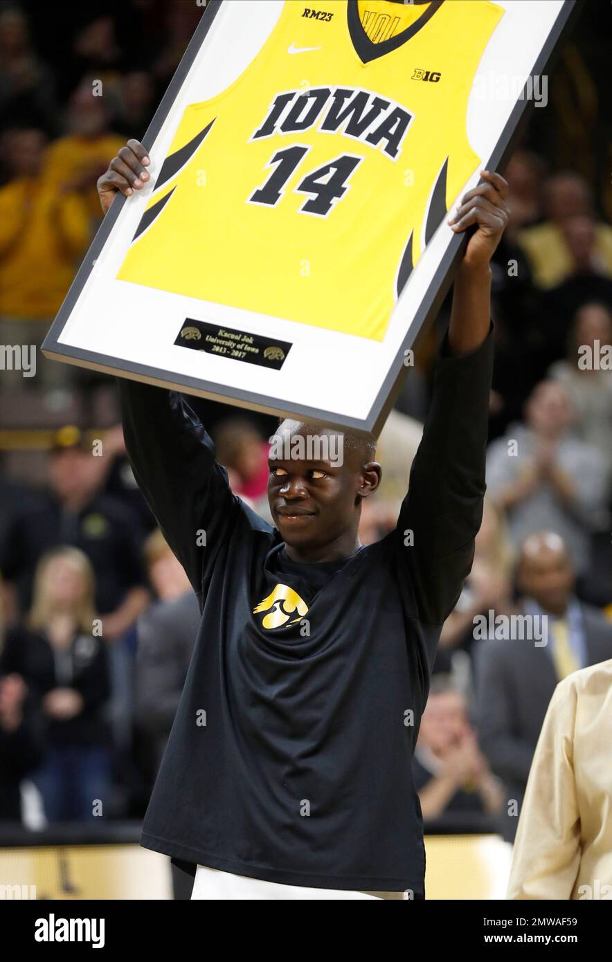 Iowa guard Peter Jok stands on the court during senior day ceremonies ...
