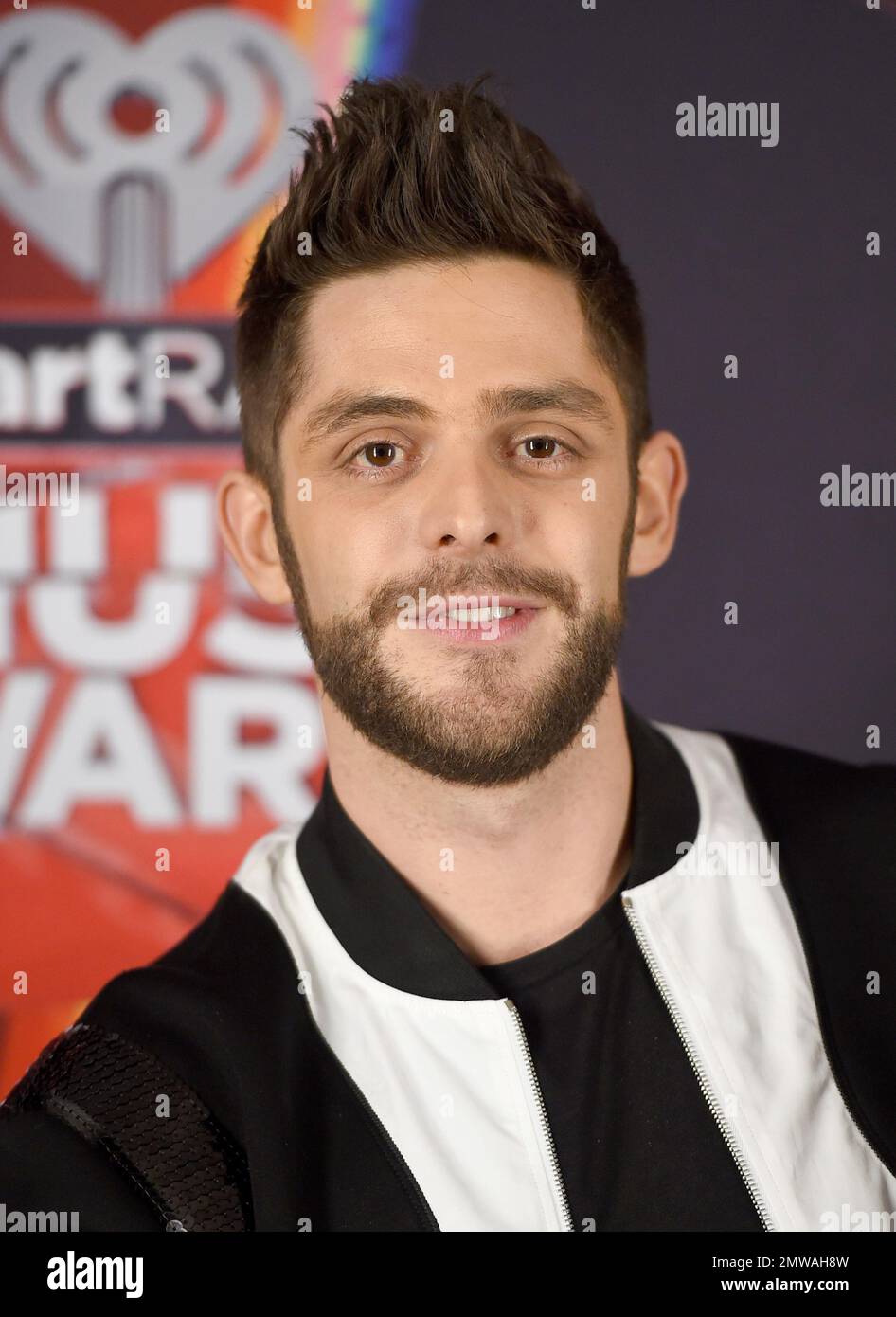 Thomas Rhett poses in the press room at the iHeartRadio Music Awards at ...