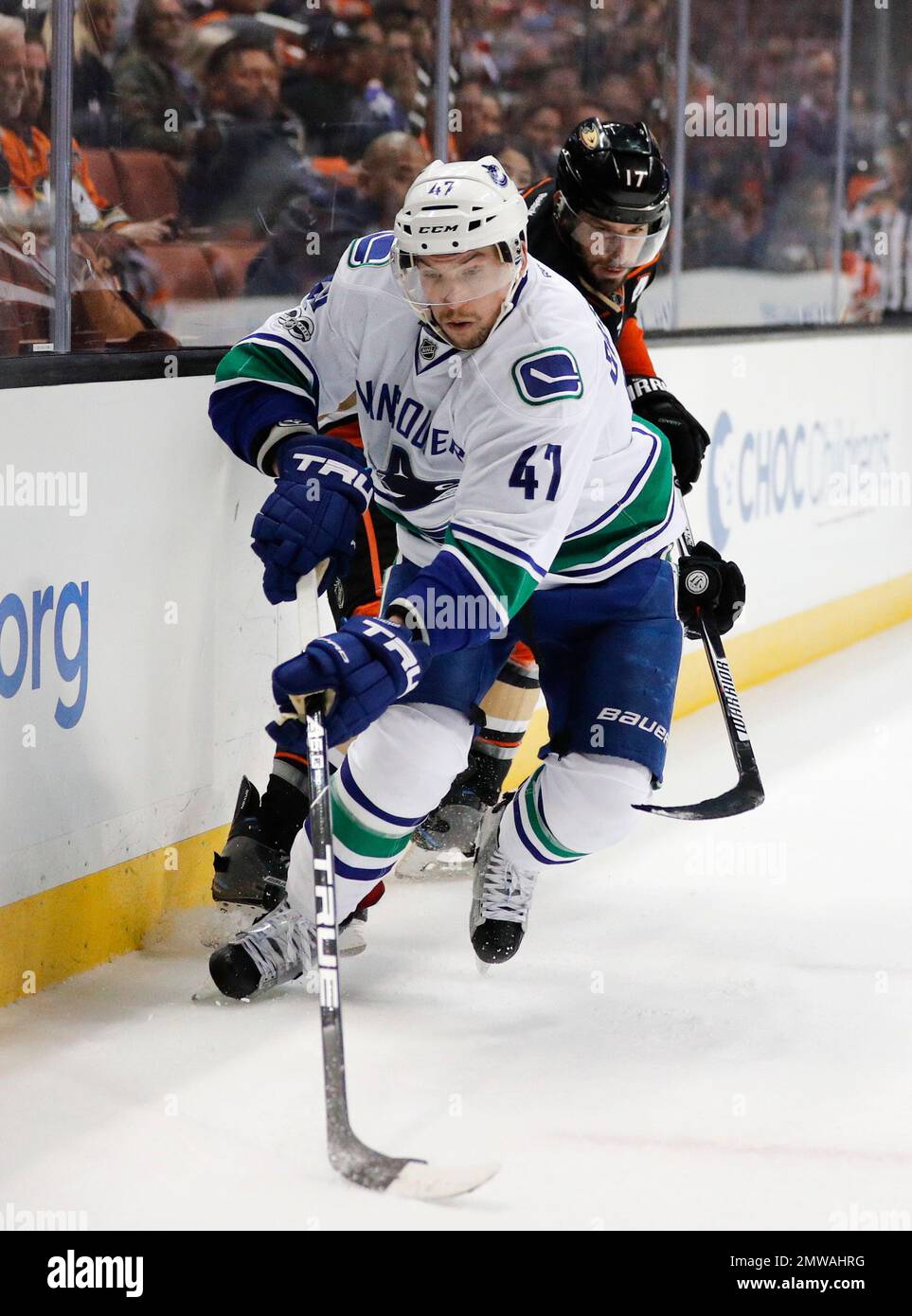 Vancouver Canucks' Sven Baertschi, front, of Switzerland, moves the ...