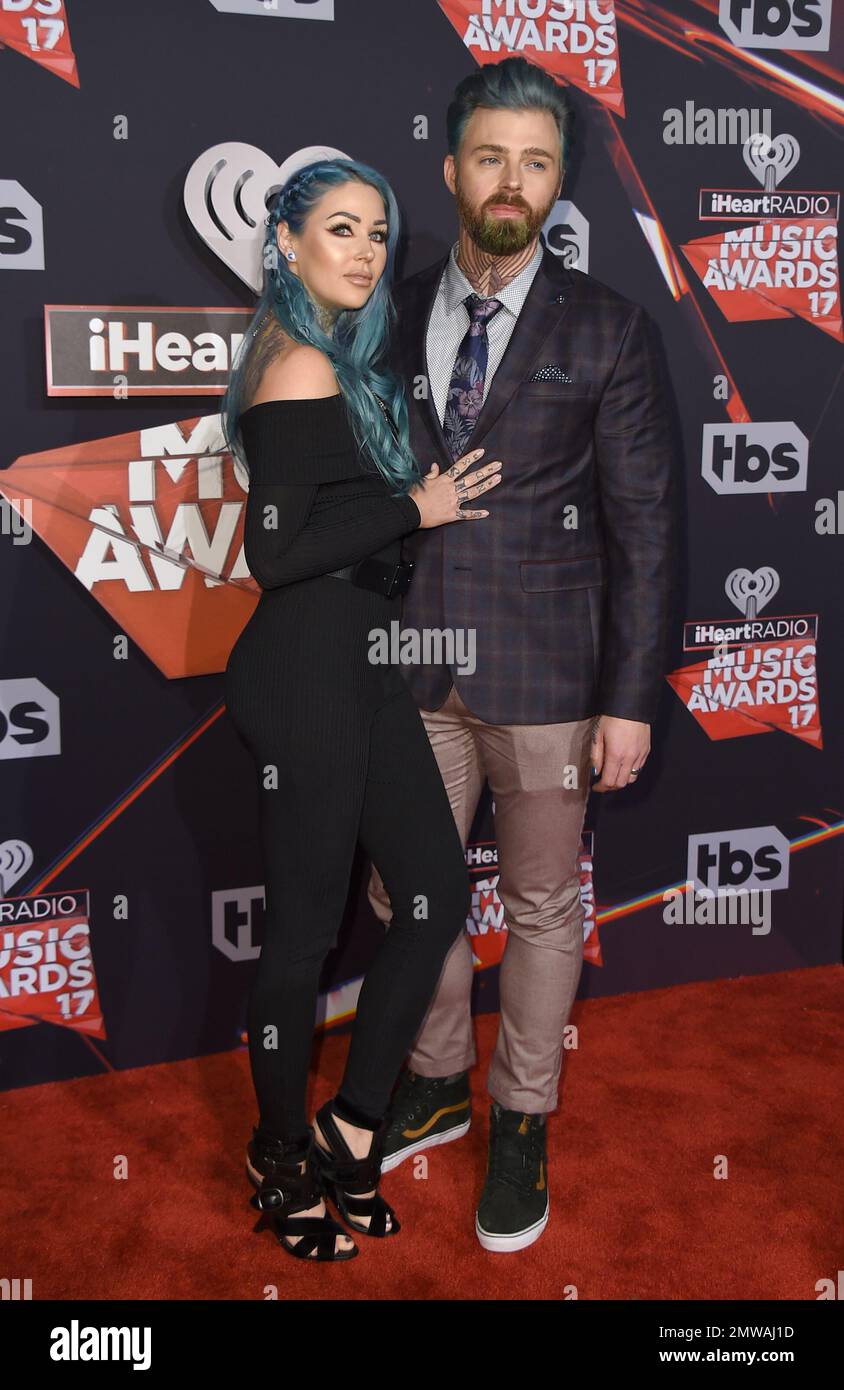 Kristen Leanne, left, and Ryan Morgan arrive at the iHeartRadio Music ...