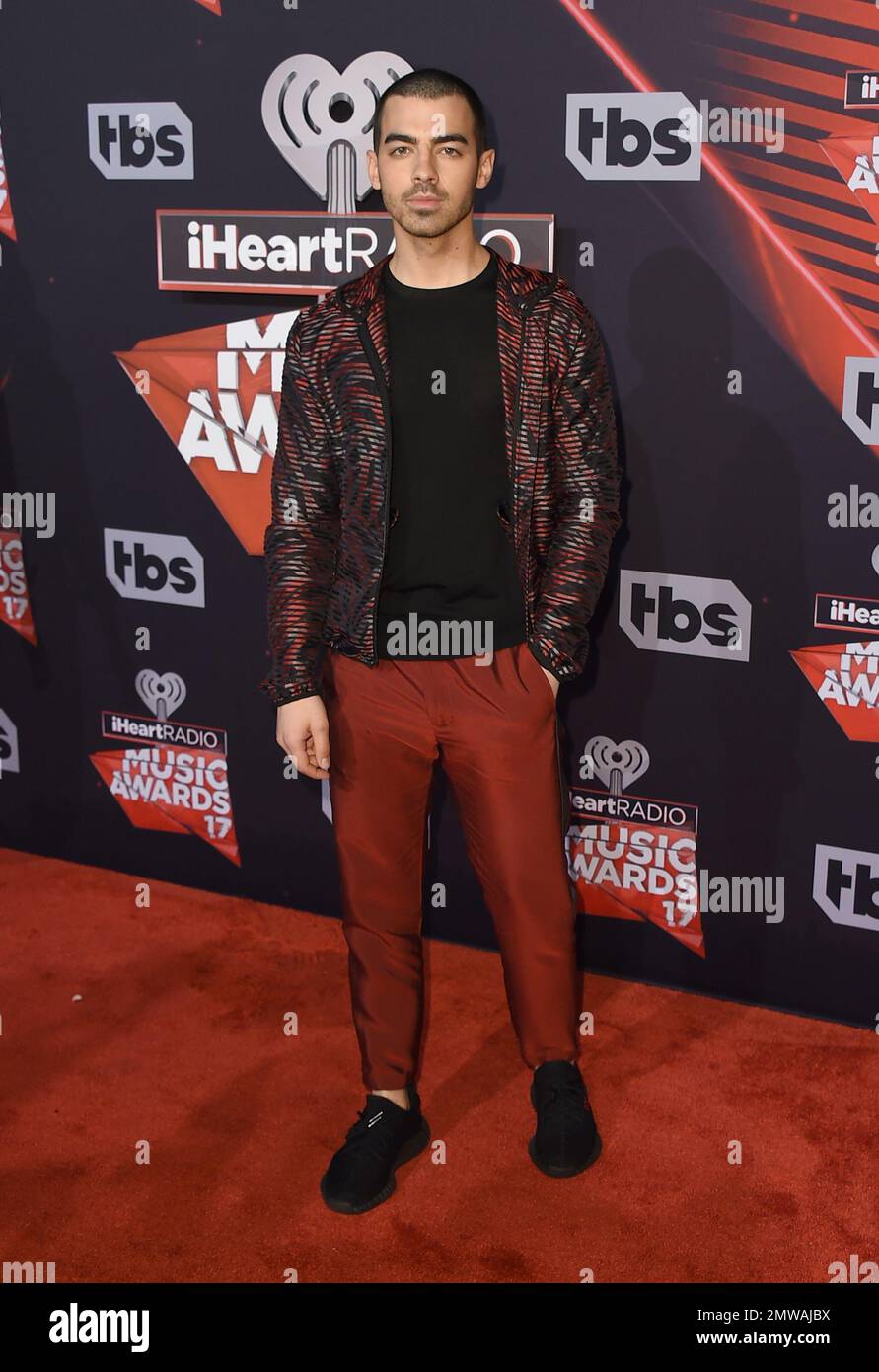 Joe Jonas arrives at the iHeartRadio Music Awards at the Forum on ...