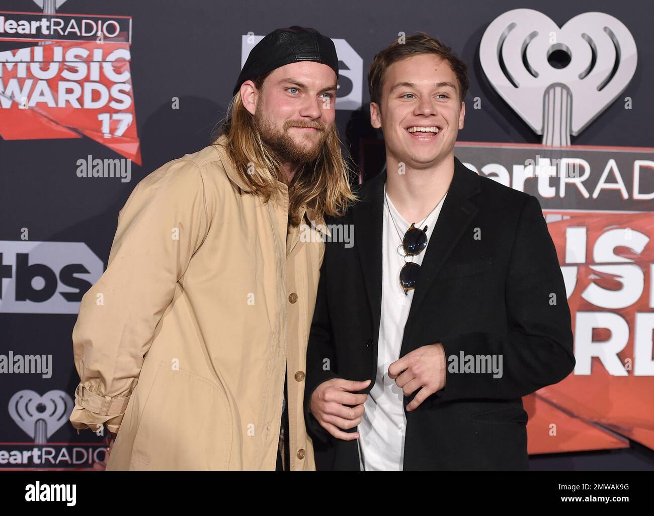 Jake Weary, left, and Finn Cole arrive at the iHeartRadio Music Awards ...