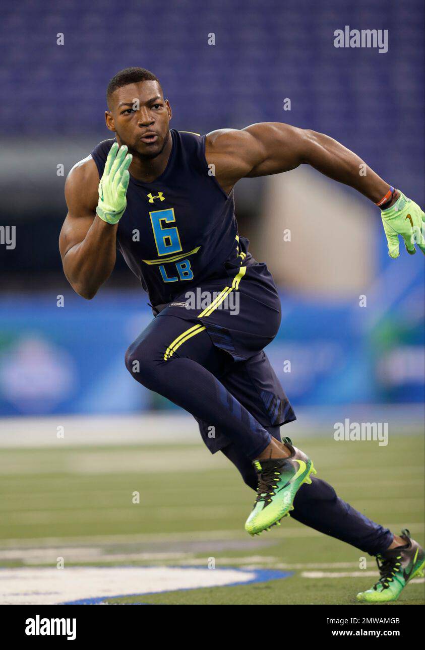 Houston linebacker Tyus Bowser runs a drill at the NFL football ...