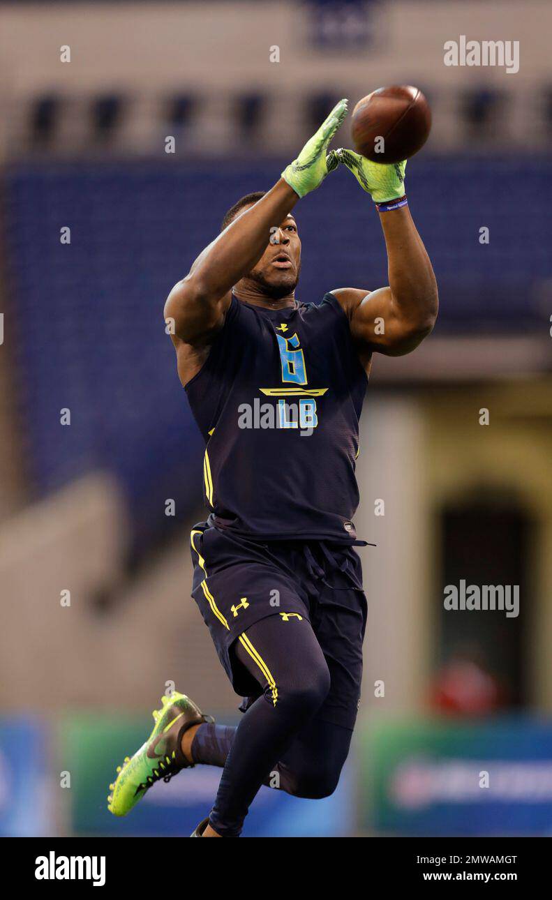 Houston linebacker Tyus Bowser runs a drill at the NFL football ...
