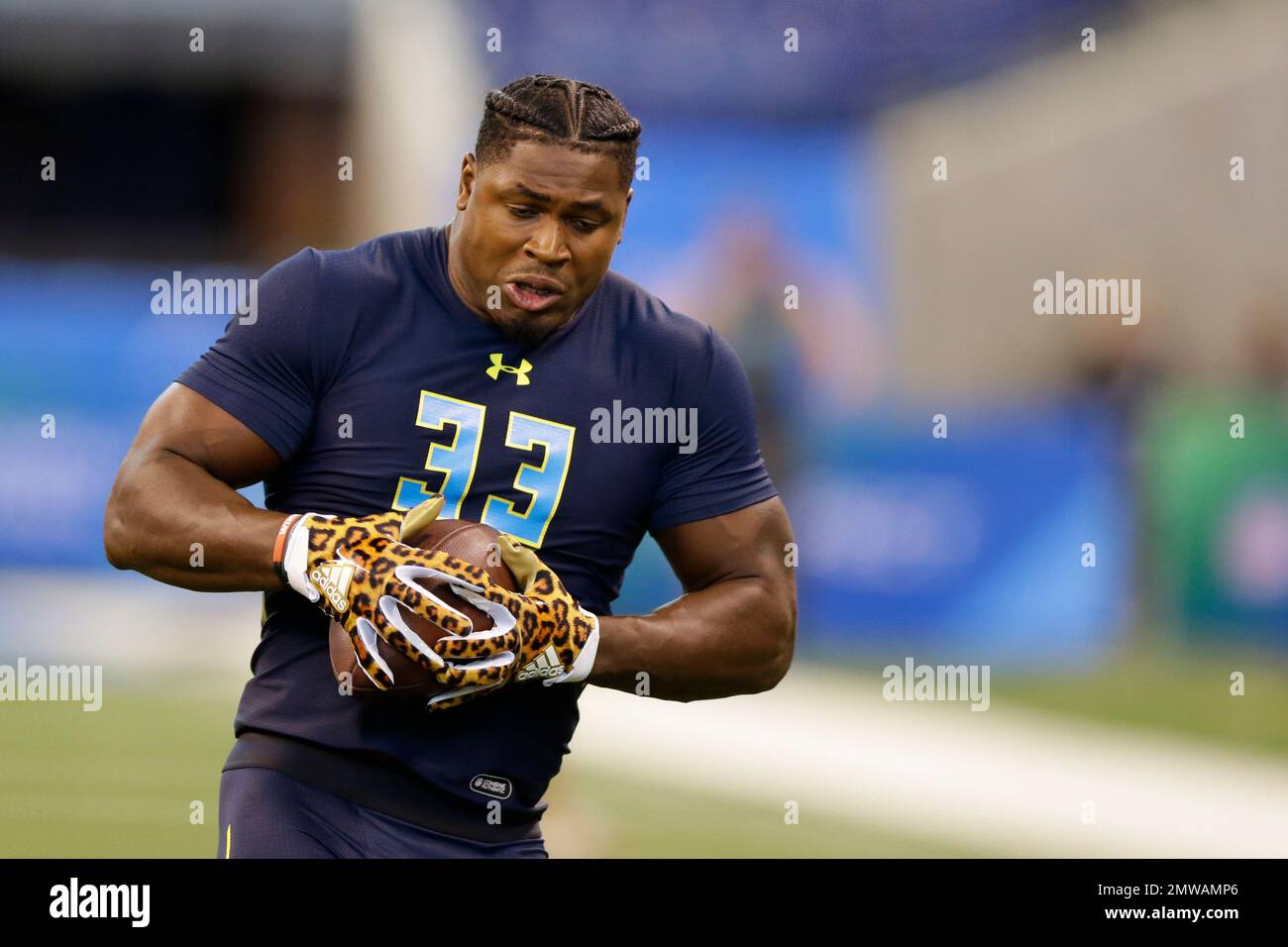 Miami defensive end Al-Quadin Muhammad runs a drill at the NFL football ...