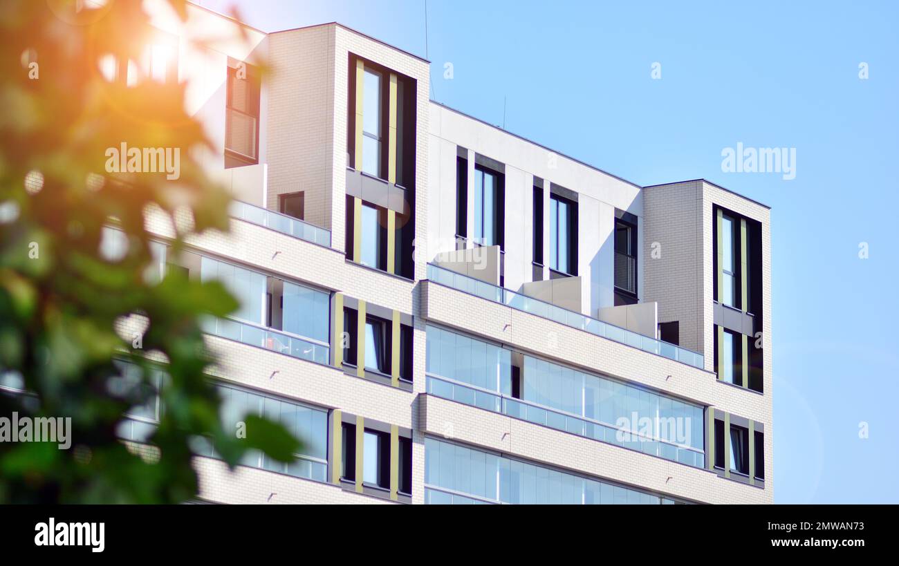 Modern apartment buildings on a sunny day with a blue sky. Facade of a ...