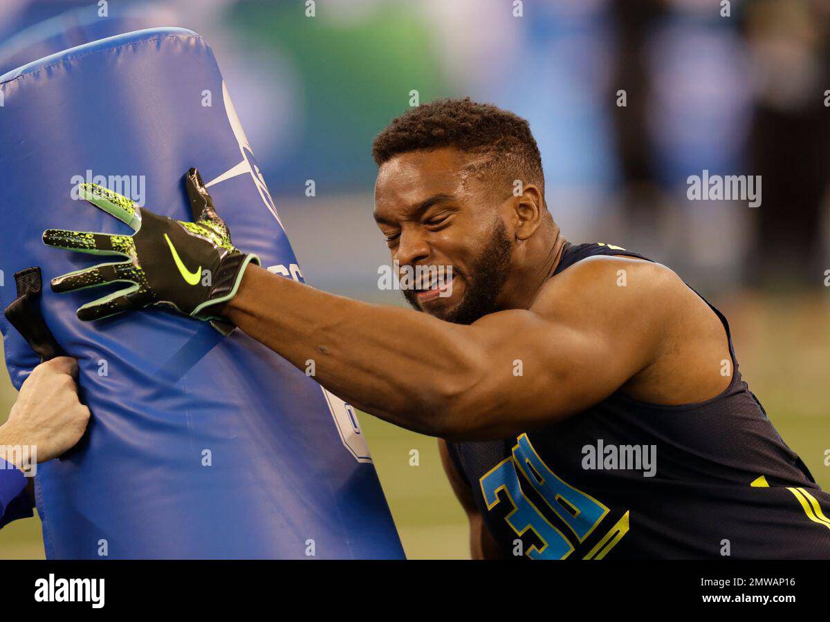 Pittsburgh defensive end Ejuan Price runs a drill at the NFL football ...