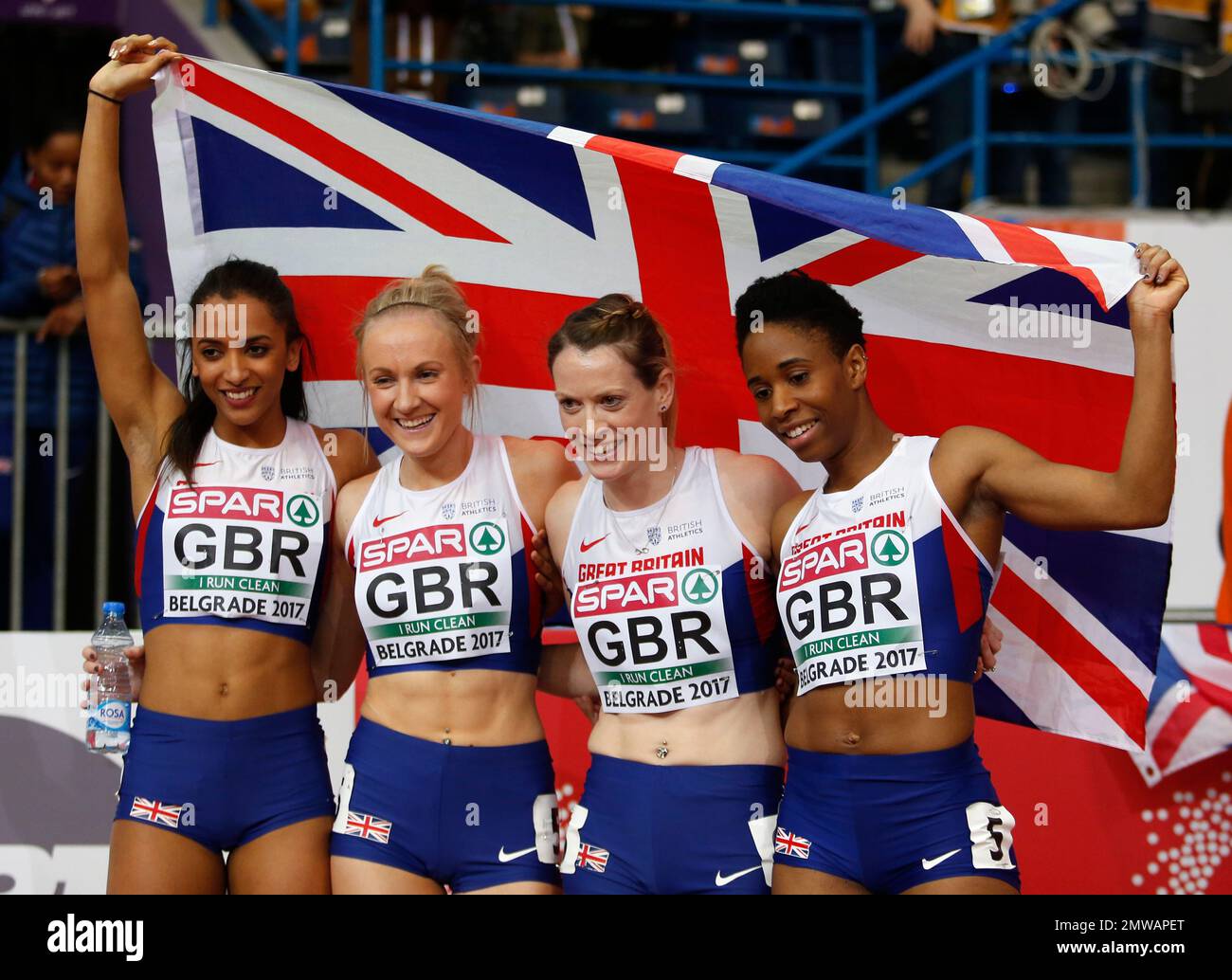 The relay team from Britain celebrate after winning the silver medal in ...