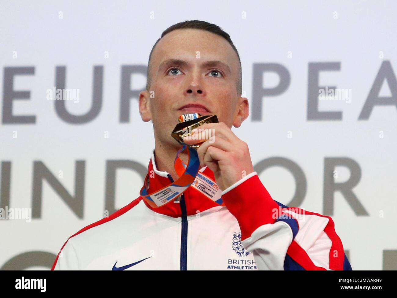 Britain's Richard Kilty shows off his gold medal during the ceremony ...