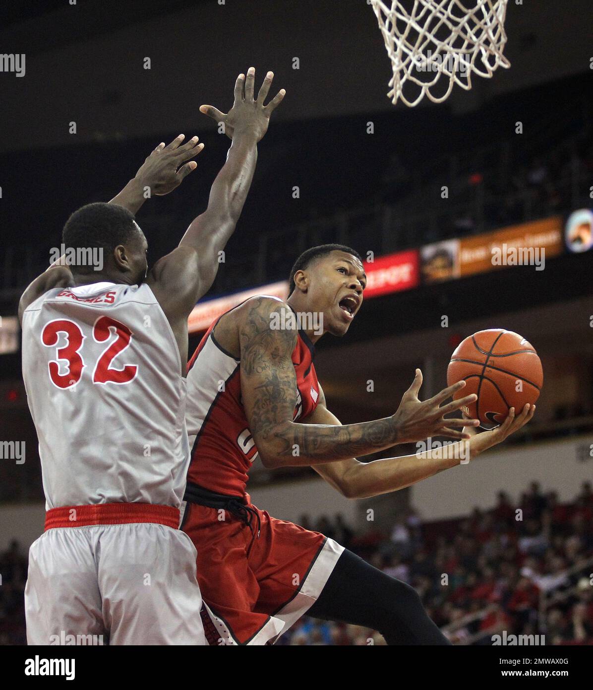 UNLV's Troy Baxter Jr. goes in for a layup against Fresno State's Nate ...