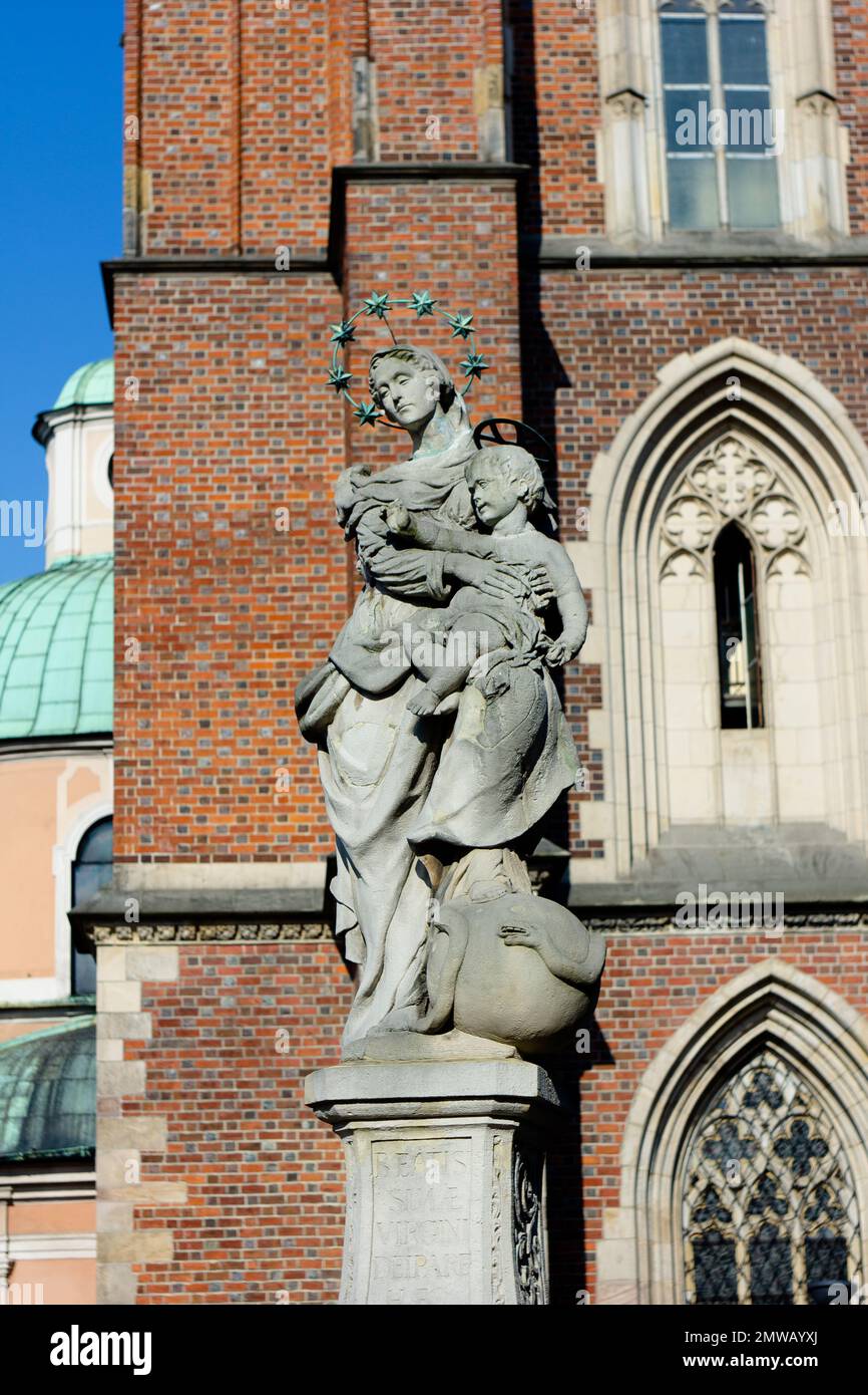 The Stone statue of Madonna and Child in front of Cathedral of St. John ...