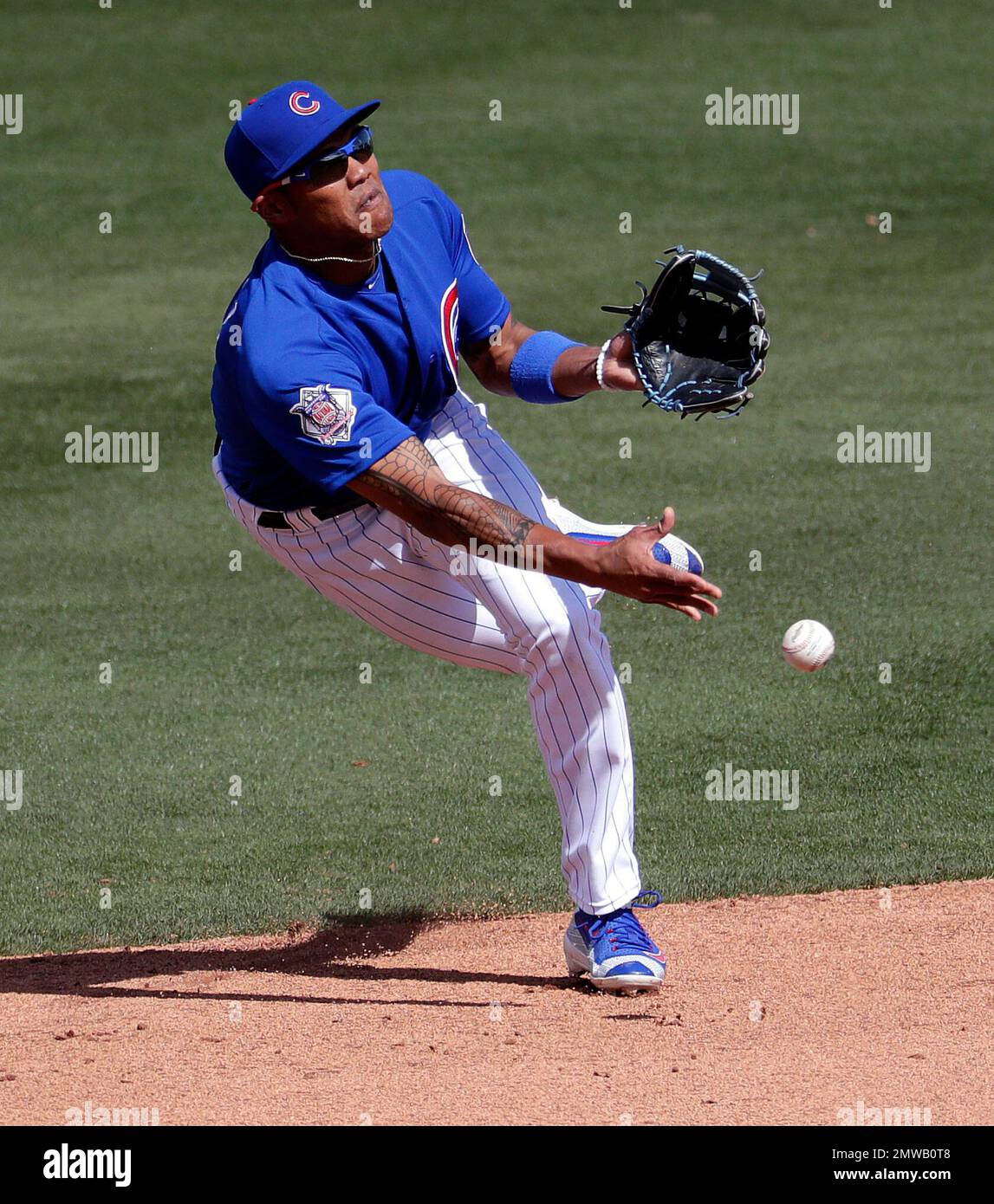 Chicago Cubs shortstop Addison Russell fields a ground out by Los ...