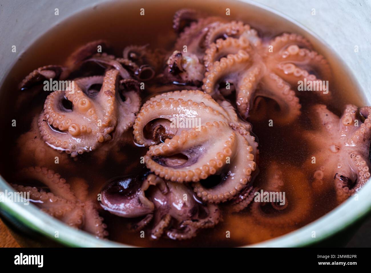 Boiled octopus is in the pan. Pulpo a la Gallega (Galician-style ...