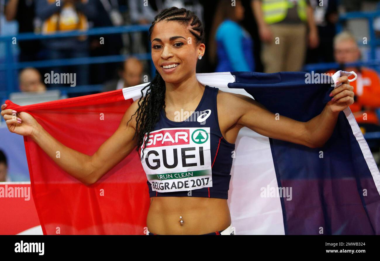 France's Floria Guei celebrates with the French flag after winning the ...