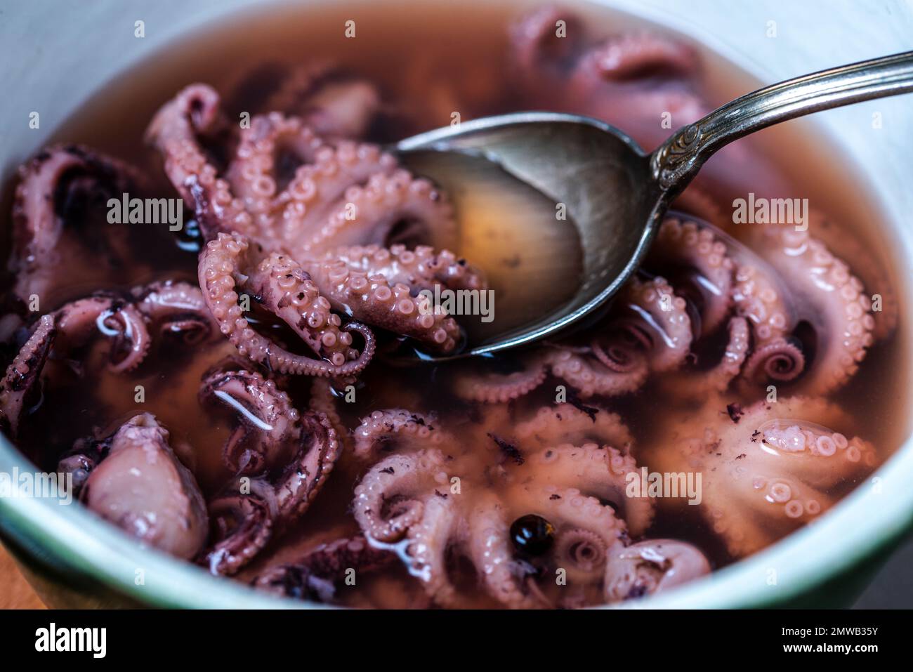 Boiled octopus is in the pan. Pulpo a la Gallega (Galician-style ...