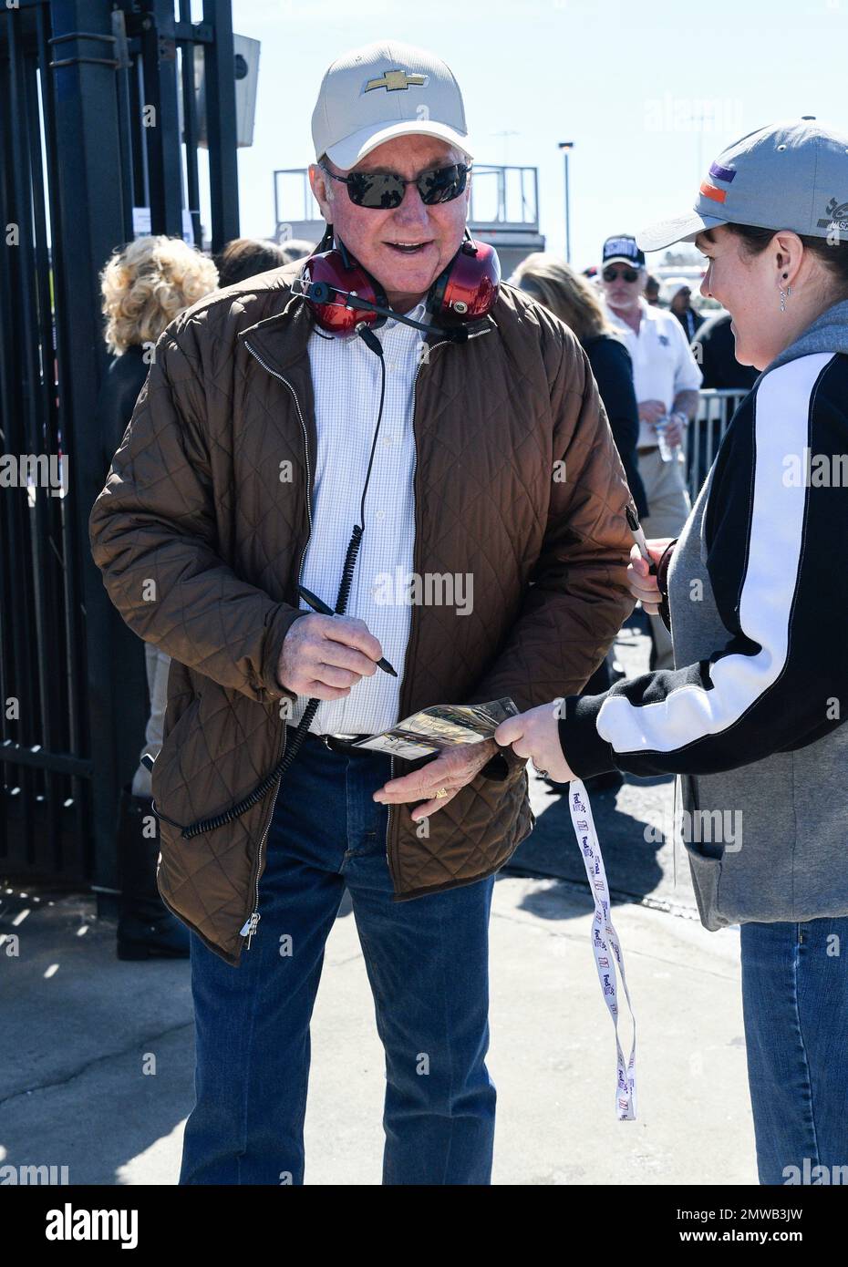 Racing team owner Richard Childress, left, talks to a fan during ...