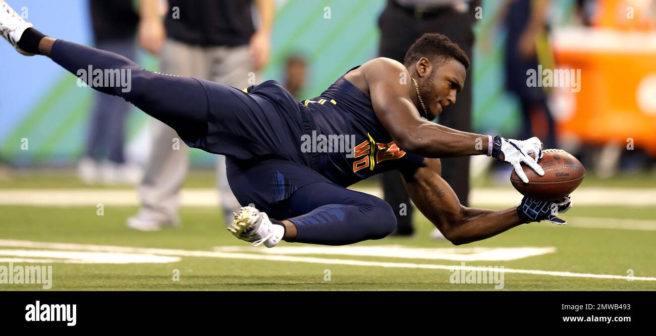 Penn State wide receiver Chris Godwin catches a pass during a drill at ...