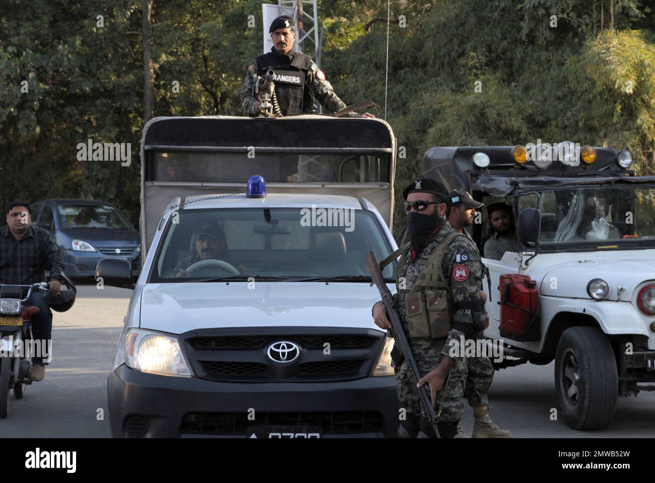 Pakistani paramilitary soldiers stand guard near the an entry gate of ...