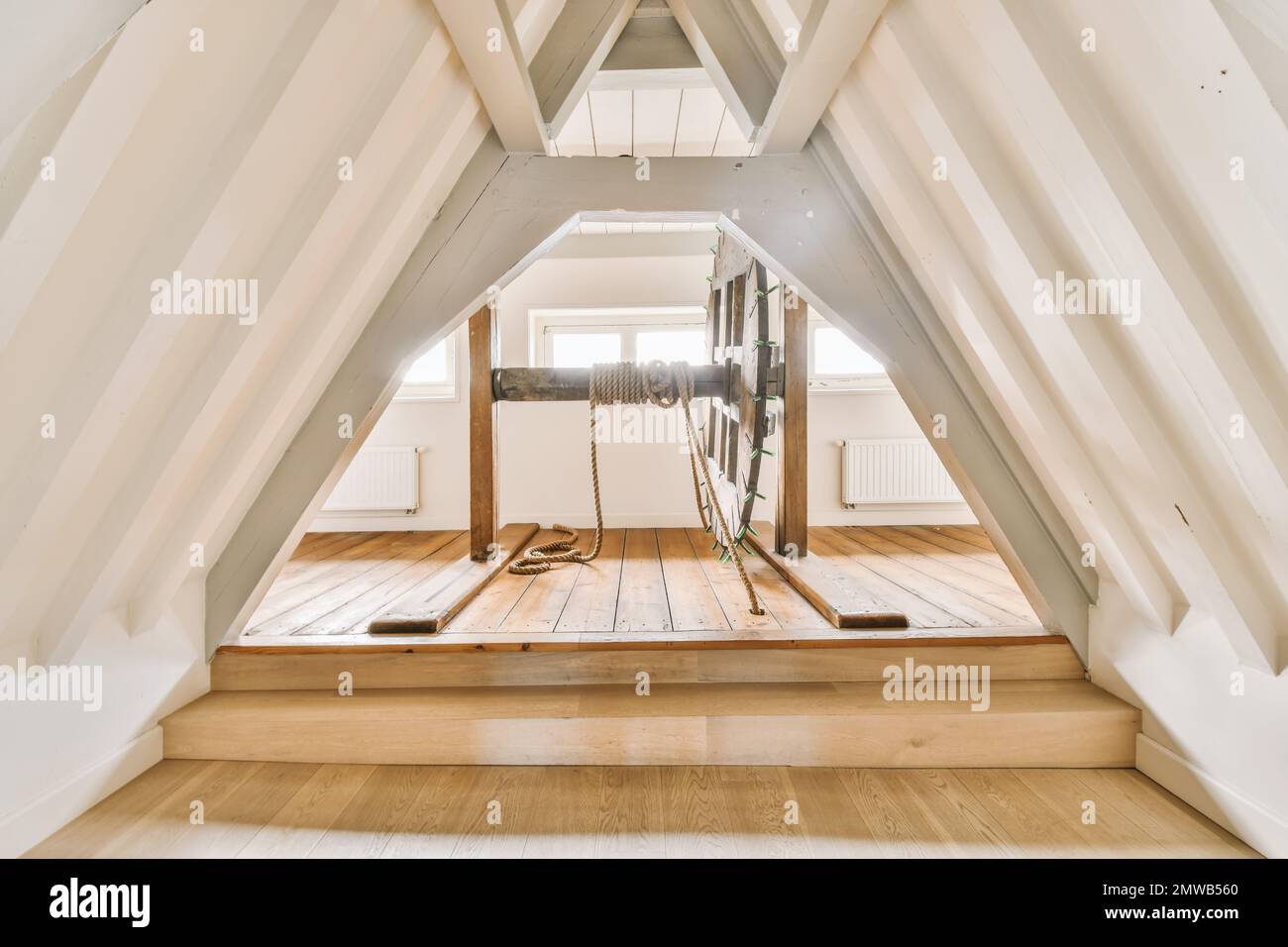 the inside of a room with wood flooring and white paint on the walls ...