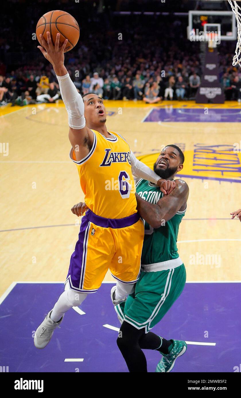Los Angeles Lakers guard Jordan Clarkson, left, shoots as Boston ...