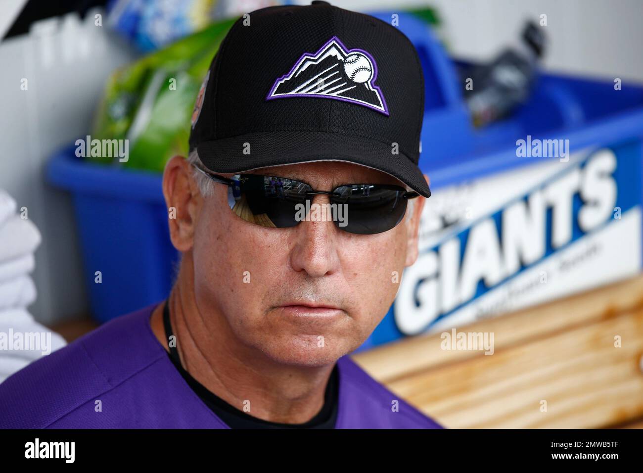 Colorado Rockies manager Bud Black sits in the dugout prior to a spring ...
