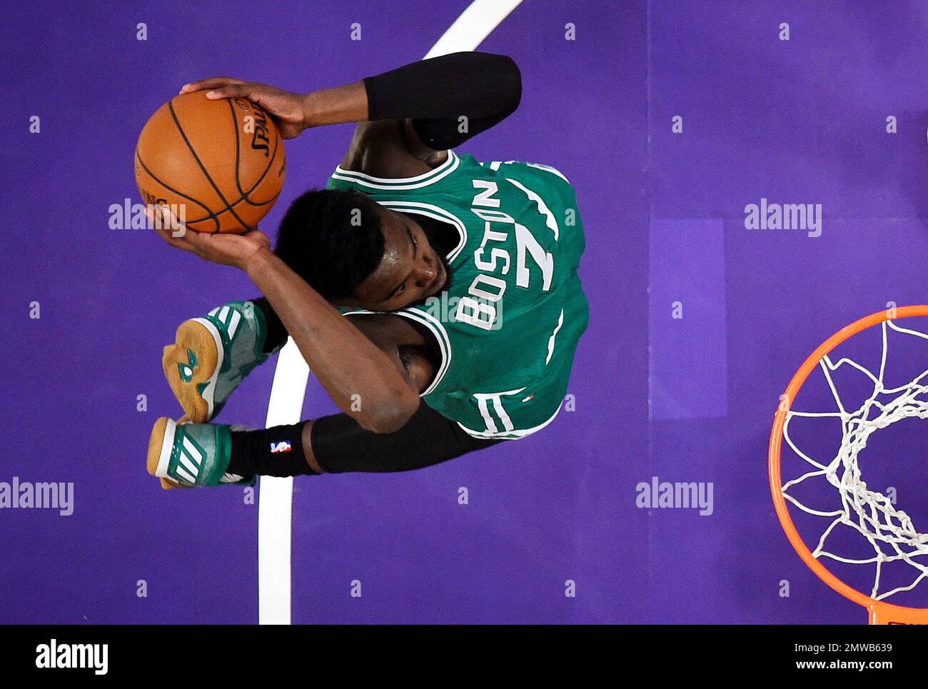 Boston Celtics forward Jaylen Brown goes in for a dunk during the first ...
