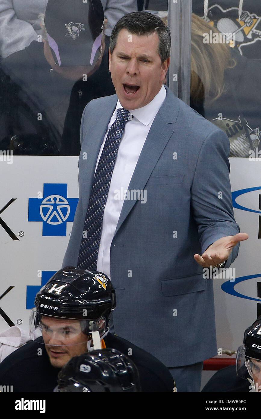 Pittsburgh Penguins head coach Mike Sullivan makes his point to an ...