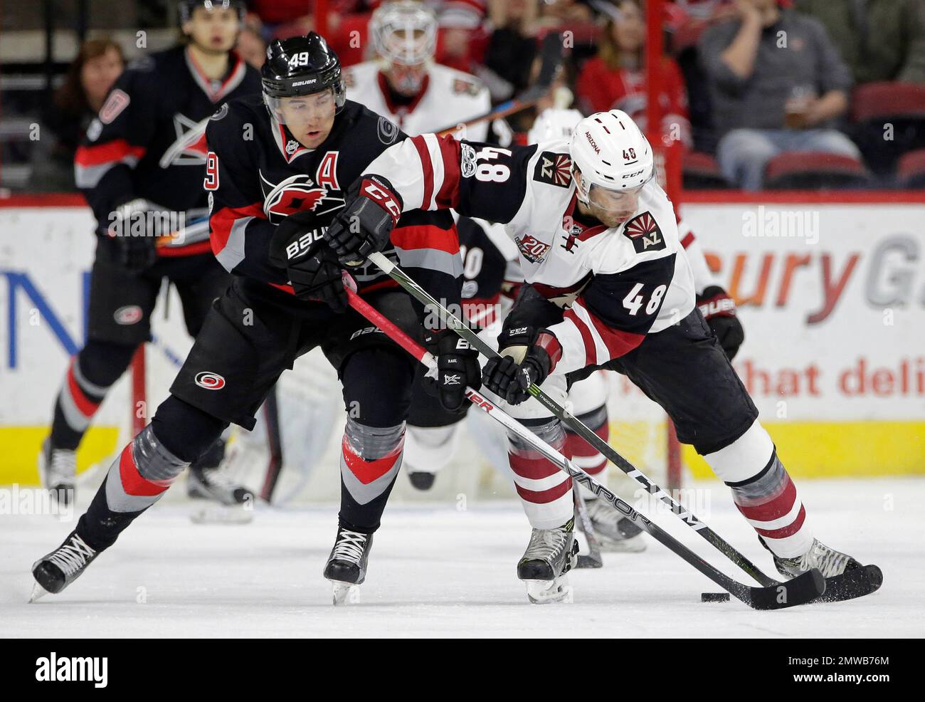 Carolina Hurricanes' Victor Rask (49), of Sweden, and Arizona Coyotes ...